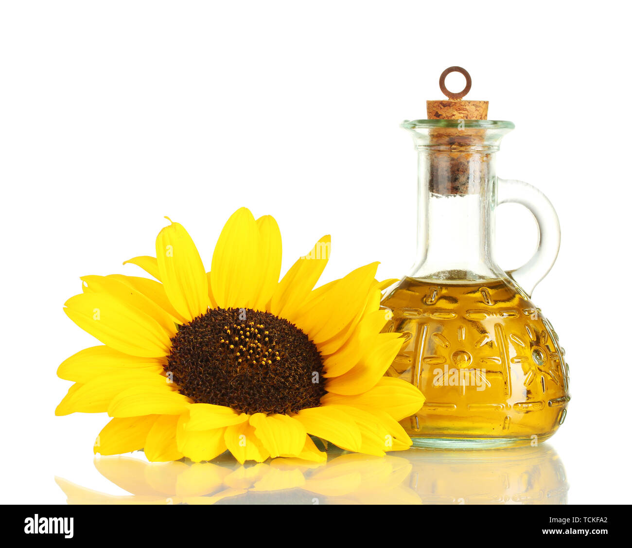 oil in bottle and sunflower, isolated on white Stock Photo - Alamy
