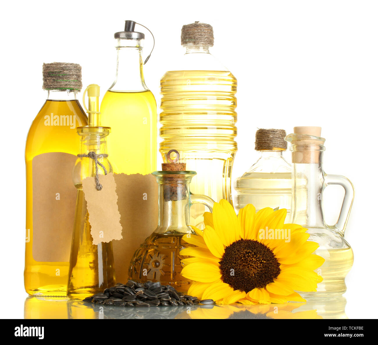 oil in bottles, sunflower and seeds, isolated on white Stock Photo - Alamy