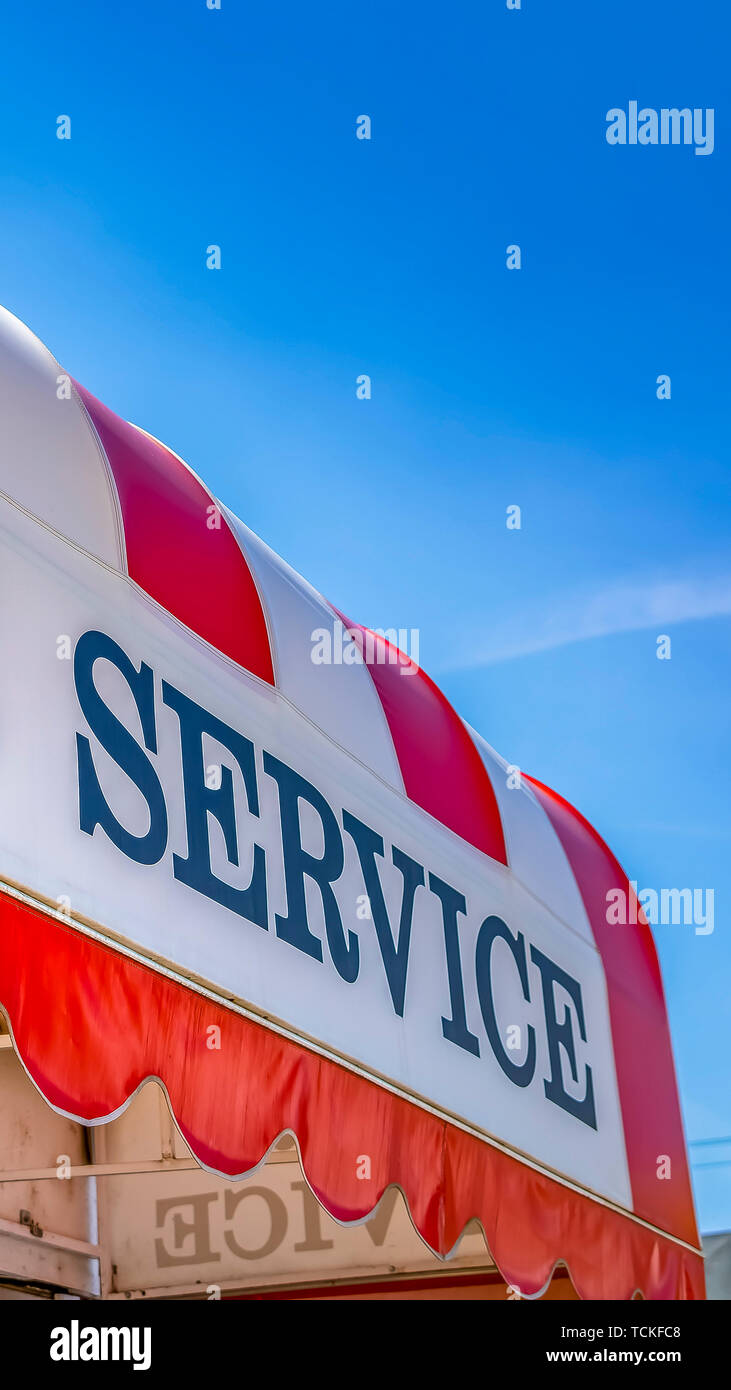 Panorama frame Car Service sign on the curved awning of a commercial ...