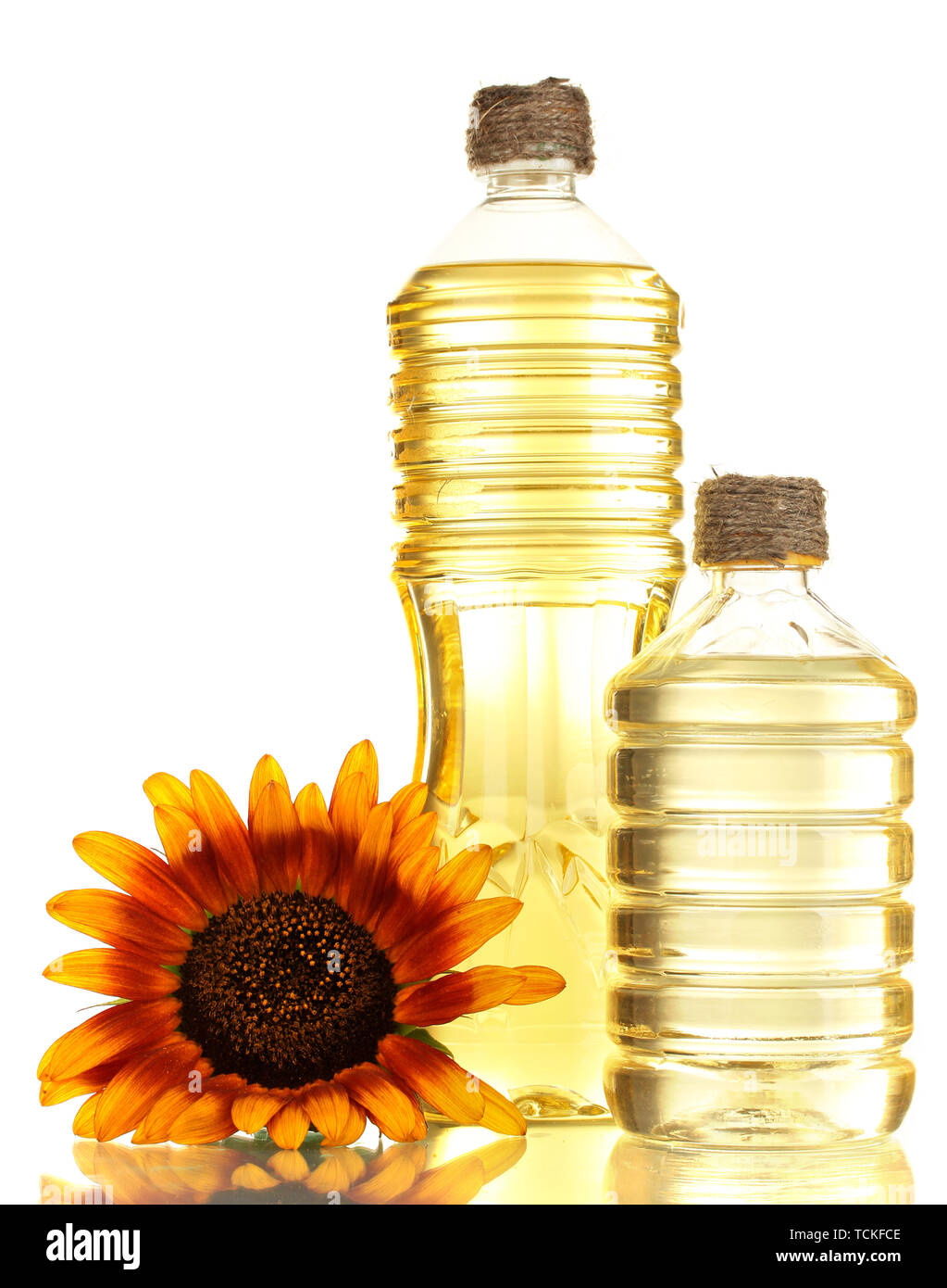 oil in bottles and sunflower, isolated on white Stock Photo - Alamy