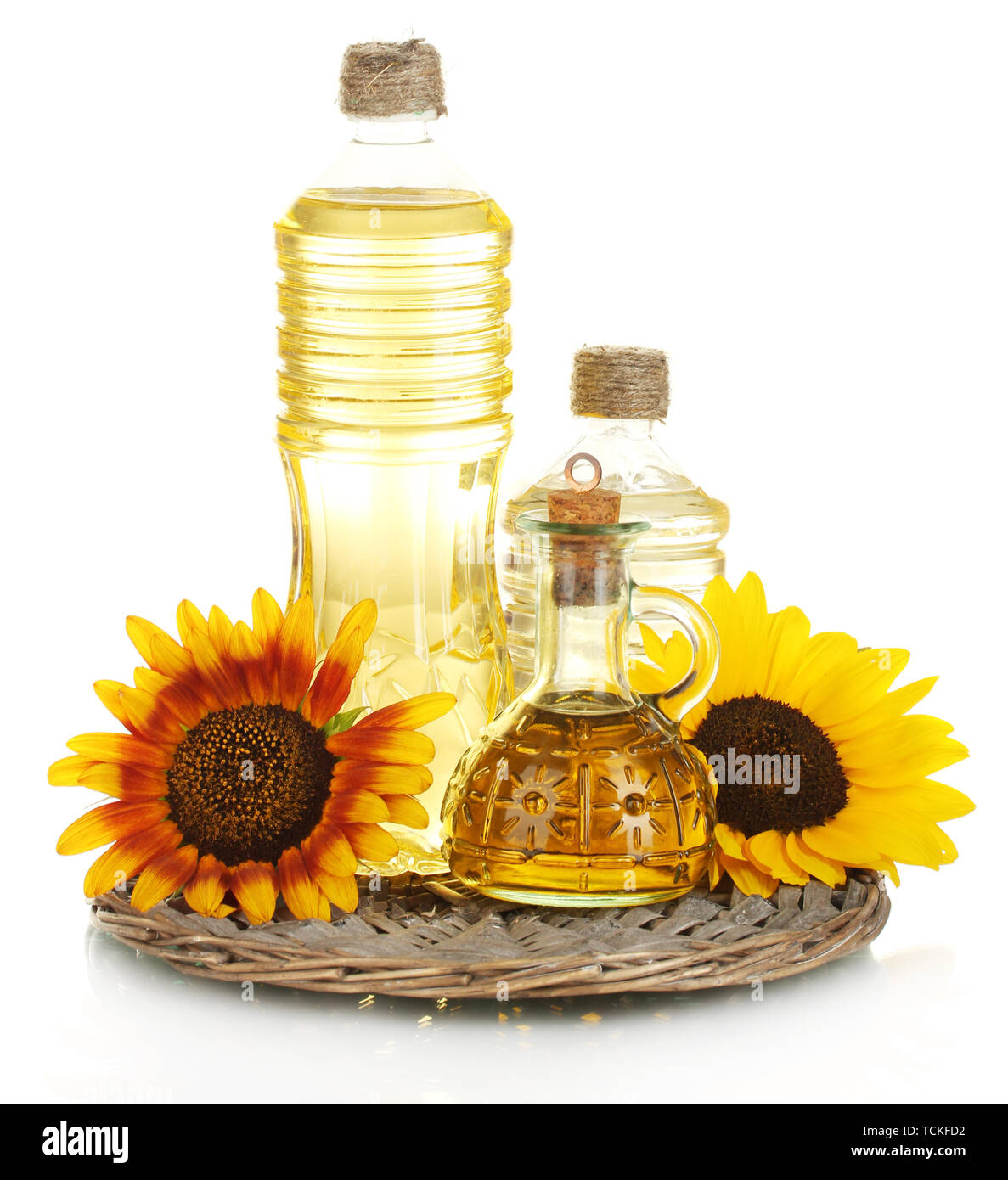 oil in bottles and sunflowers, isolated on white Stock Photo - Alamy