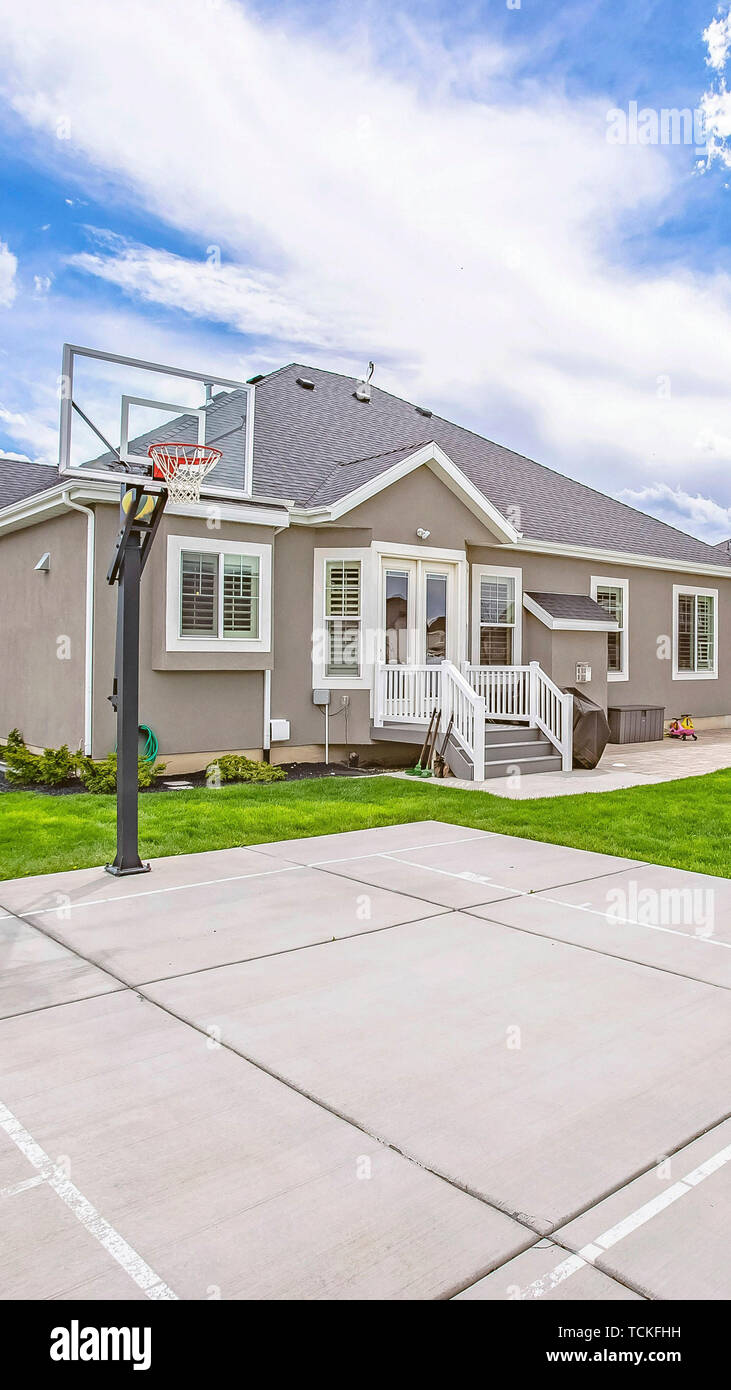 Panorama frame Basketball court and swings on the spacious yard of a ...