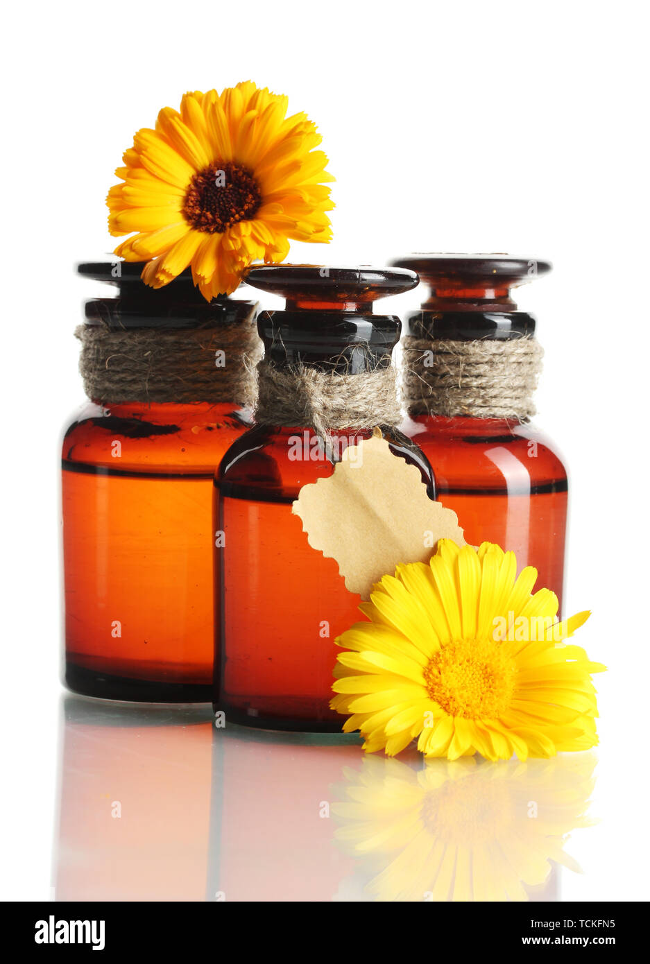 medicine bottles and beautiful calendula flowers, isolated on white ...