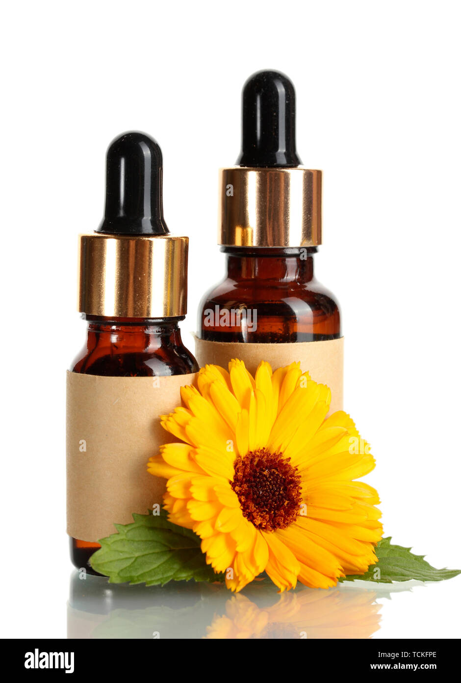 medicine bottles and beautiful calendula flowers, isolated on white ...