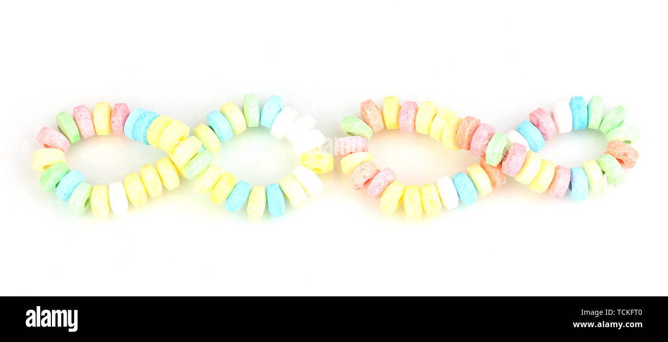 Color candies on rope isolated on white Stock Photo - Alamy