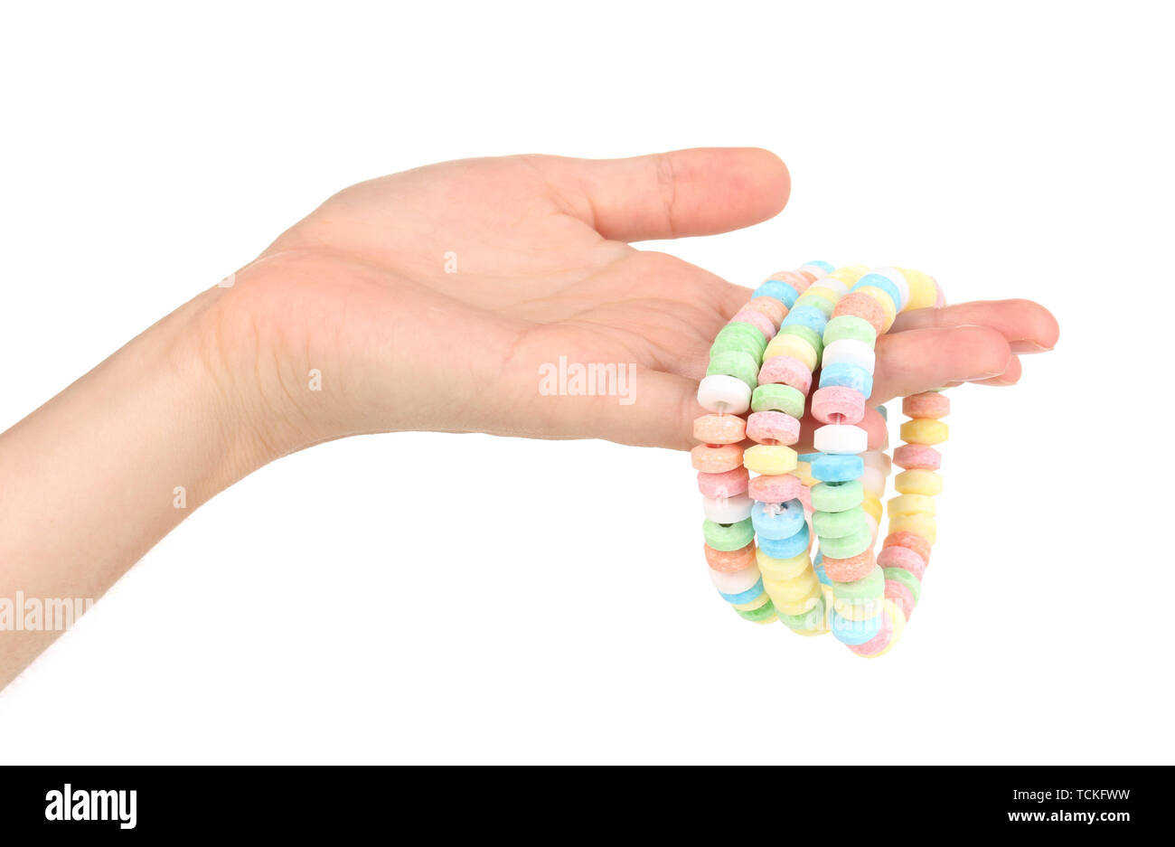 Color candies in hand isolated on white Stock Photo - Alamy