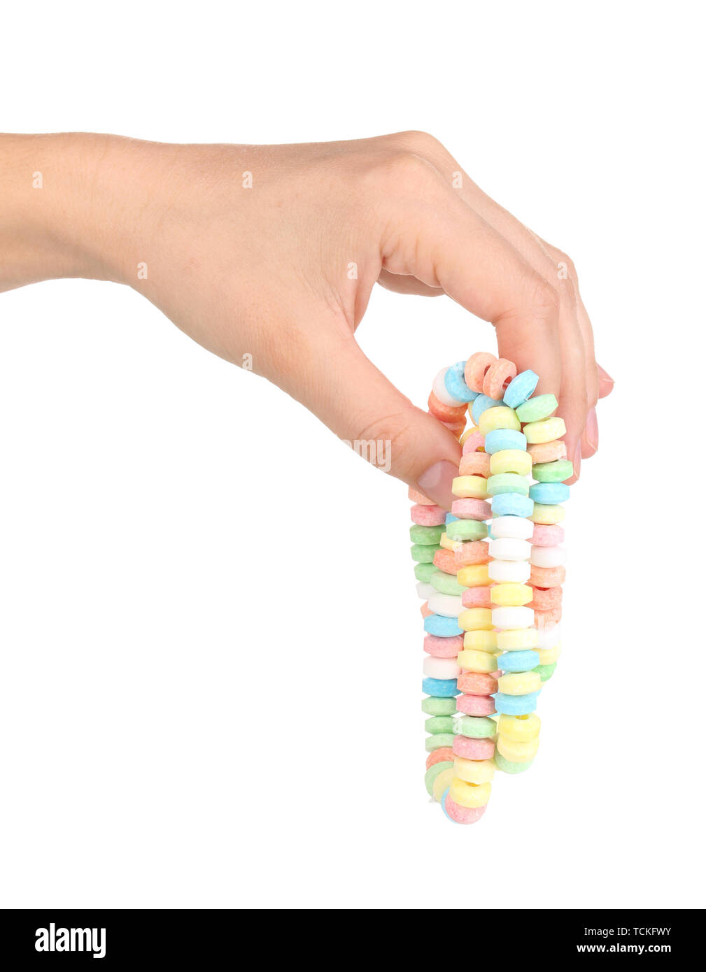 Color candies in hand isolated on white Stock Photo - Alamy