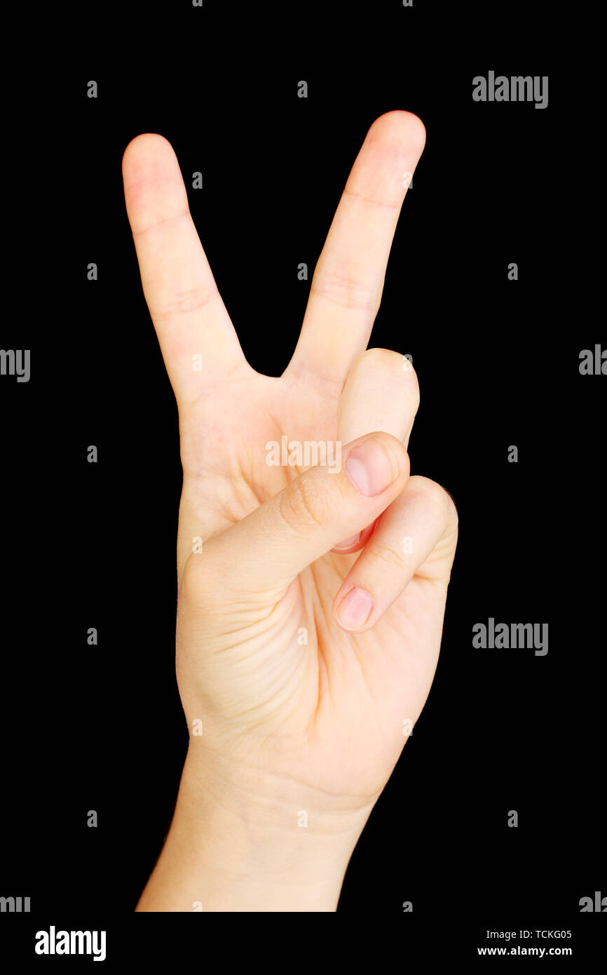 Hand making sign isolated on black Stock Photo - Alamy