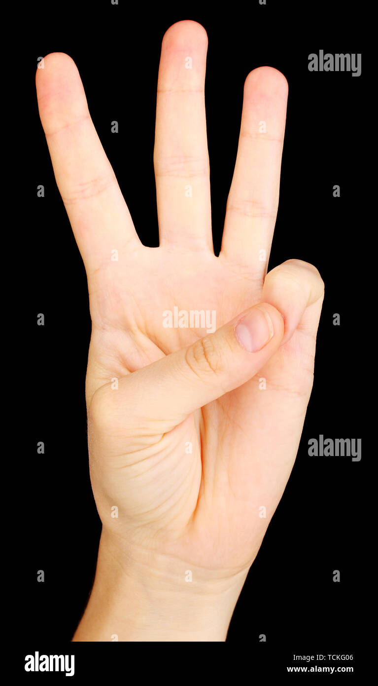 Hand making sign isolated on black Stock Photo - Alamy
