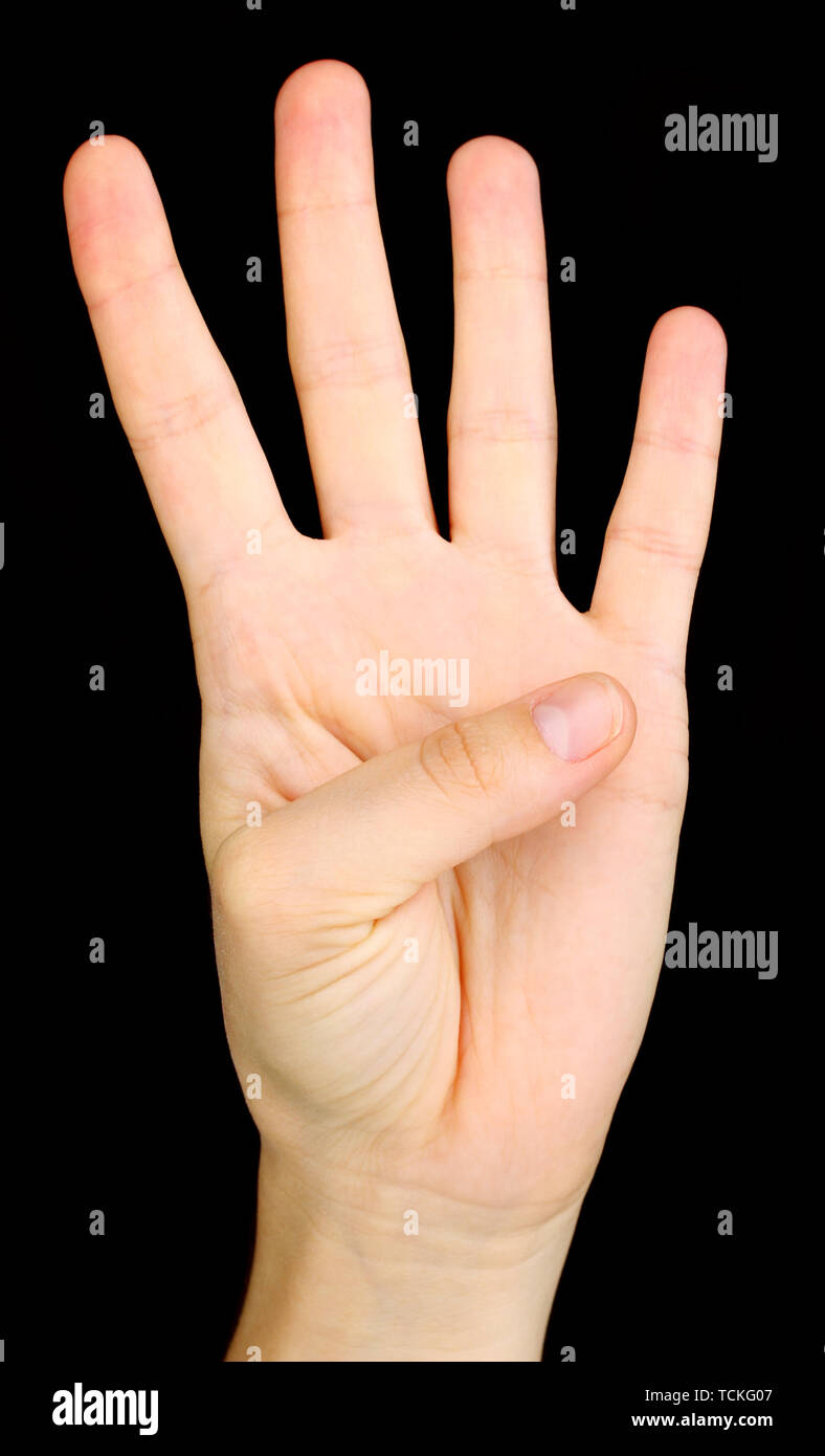 Hand making sign isolated on black Stock Photo - Alamy
