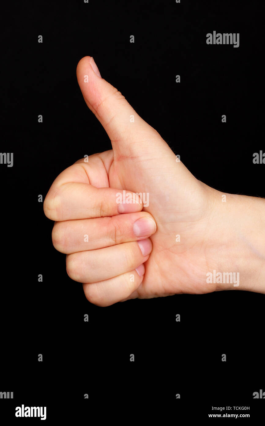 Hand making sign isolated on black Stock Photo - Alamy