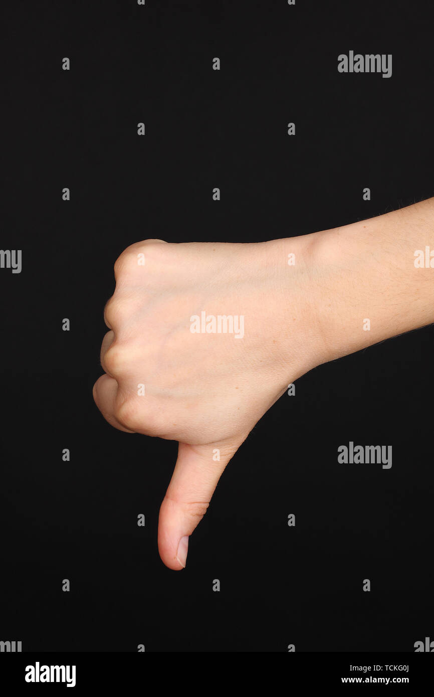 Hand making sign isolated on black Stock Photo - Alamy
