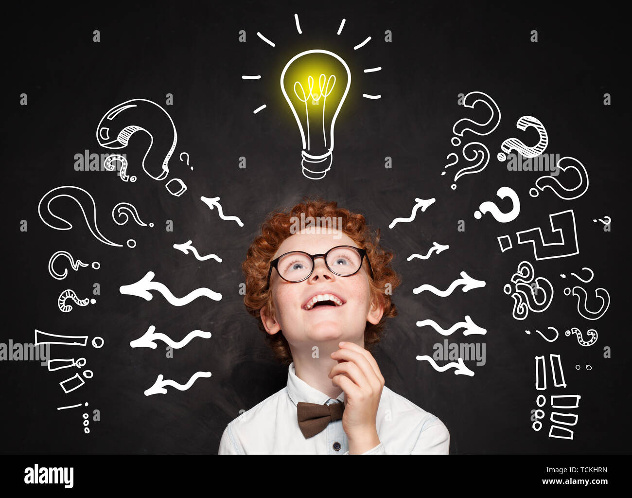 Funny child boy student with lightbulb. Brainstorming and idea concept ...