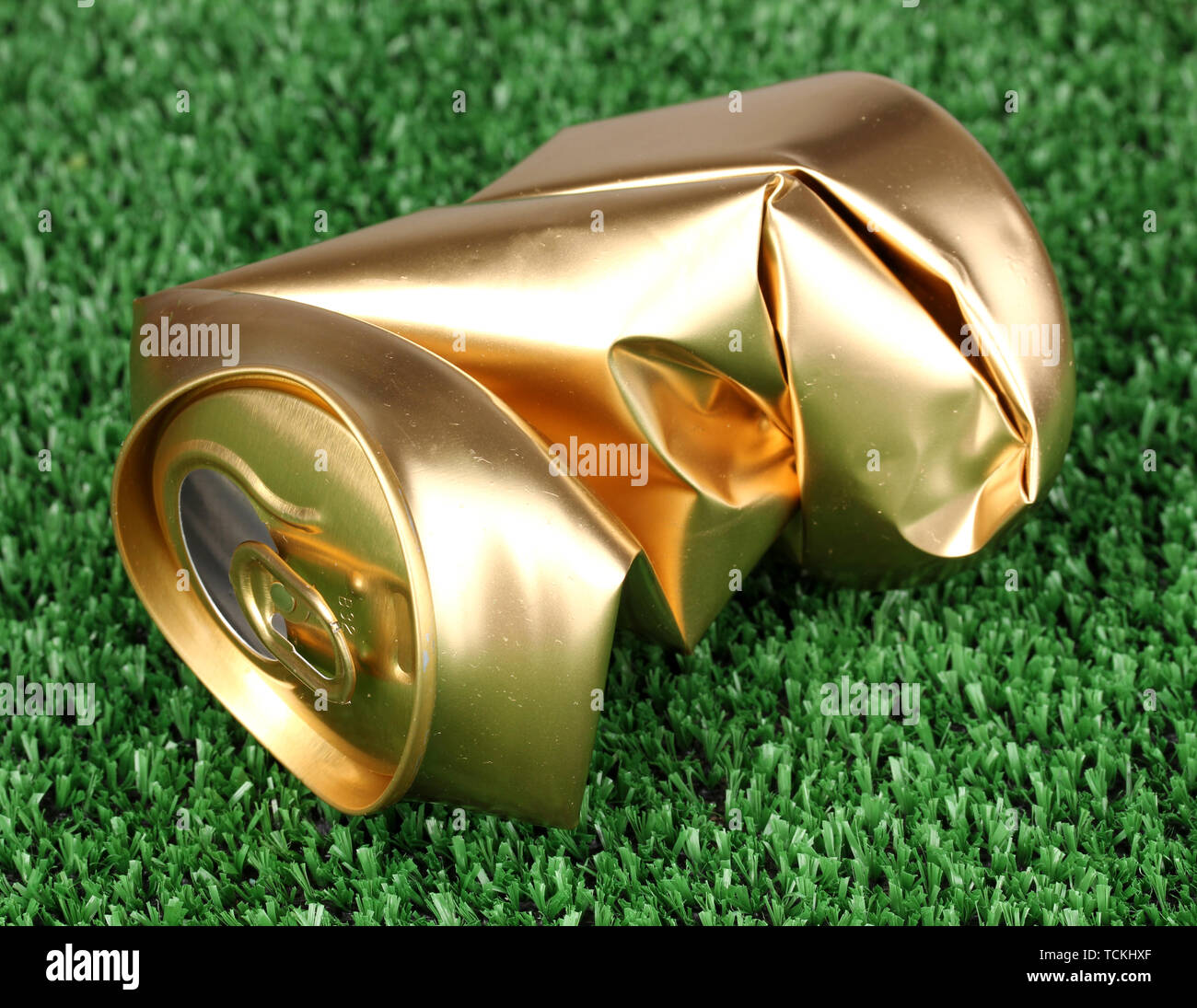 crumpled empty can on grass Stock Photo - Alamy
