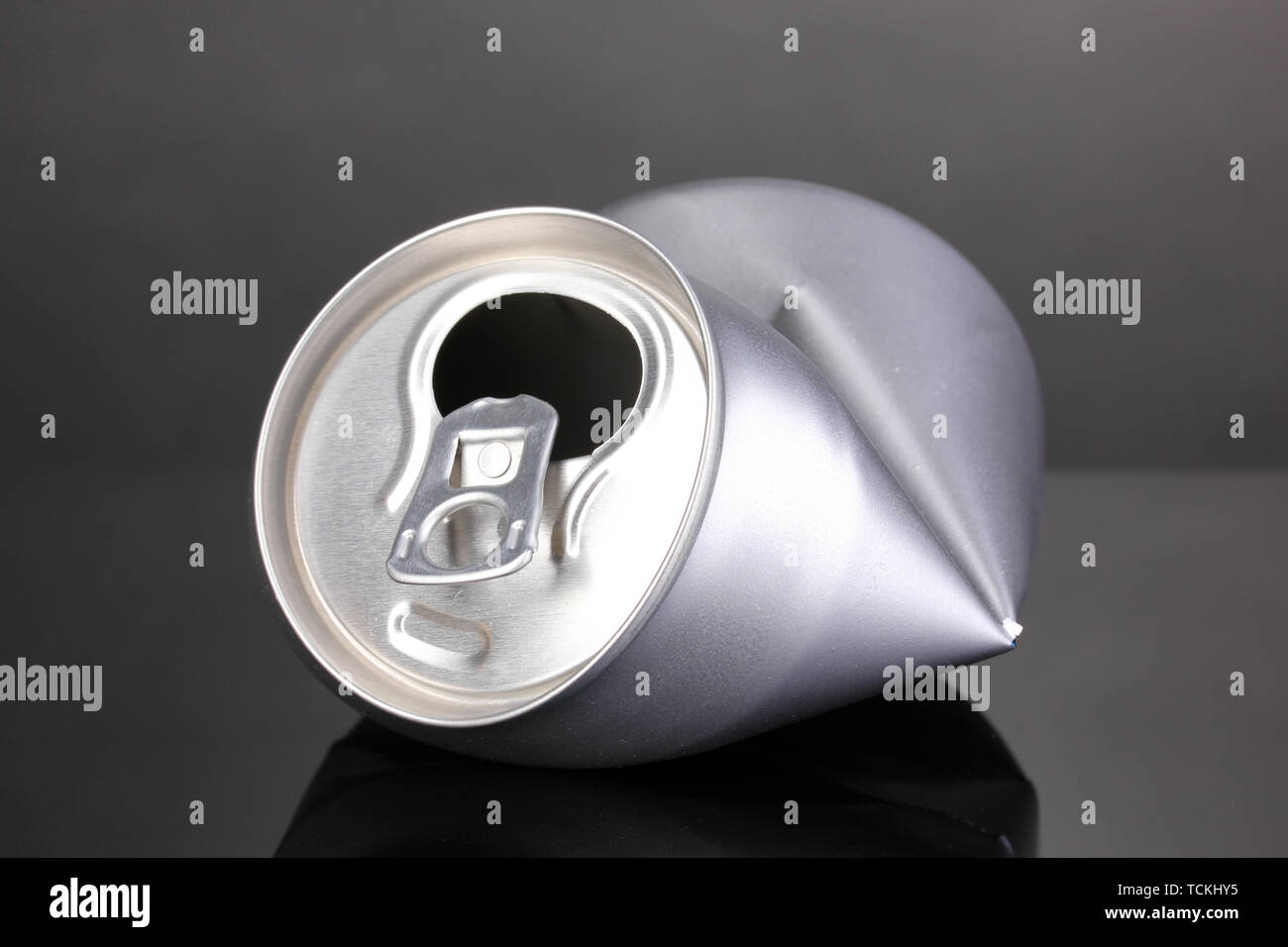 crumpled empty can on grey background Stock Photo - Alamy