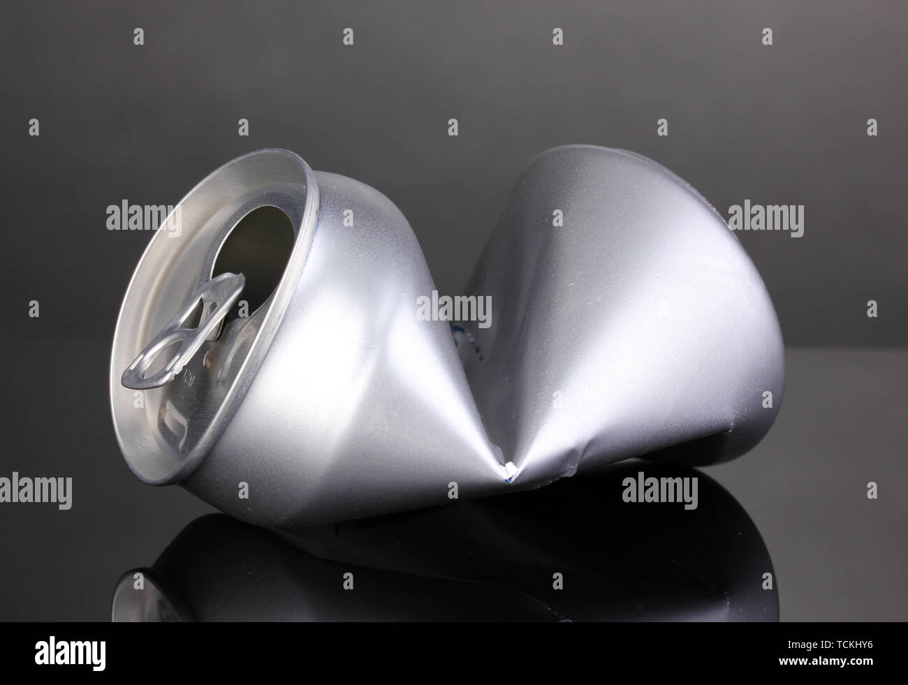 crumpled empty can on grey background Stock Photo - Alamy