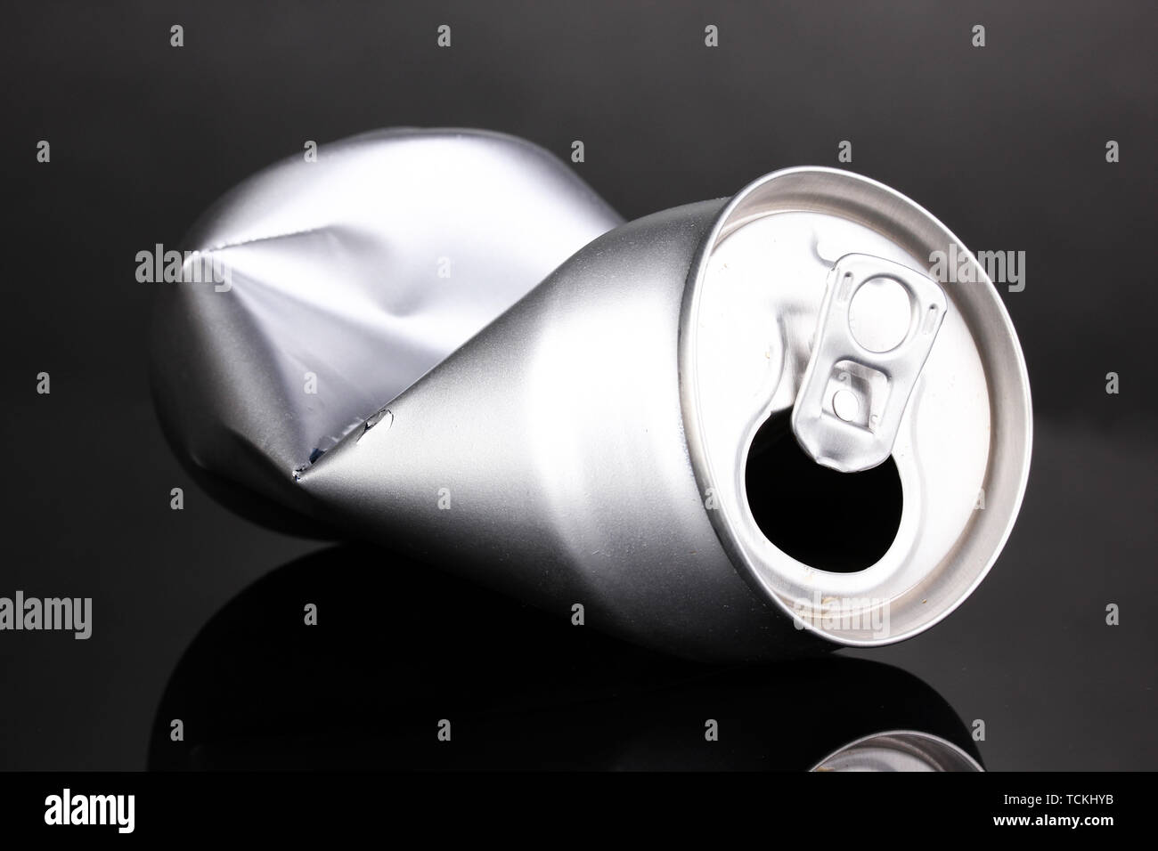 crumpled empty can on grey background Stock Photo - Alamy