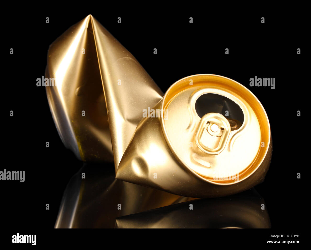 crumpled empty can isolated on black Stock Photo - Alamy