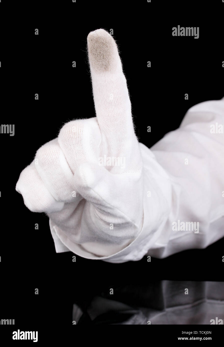 Auditor hand checking cleanliness isolated on black Stock Photo - Alamy