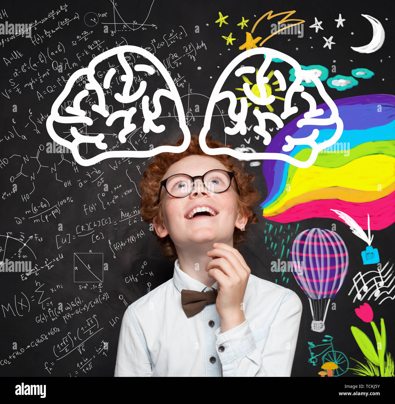 Cute smart child boy on blackboard background with maths formula and ...