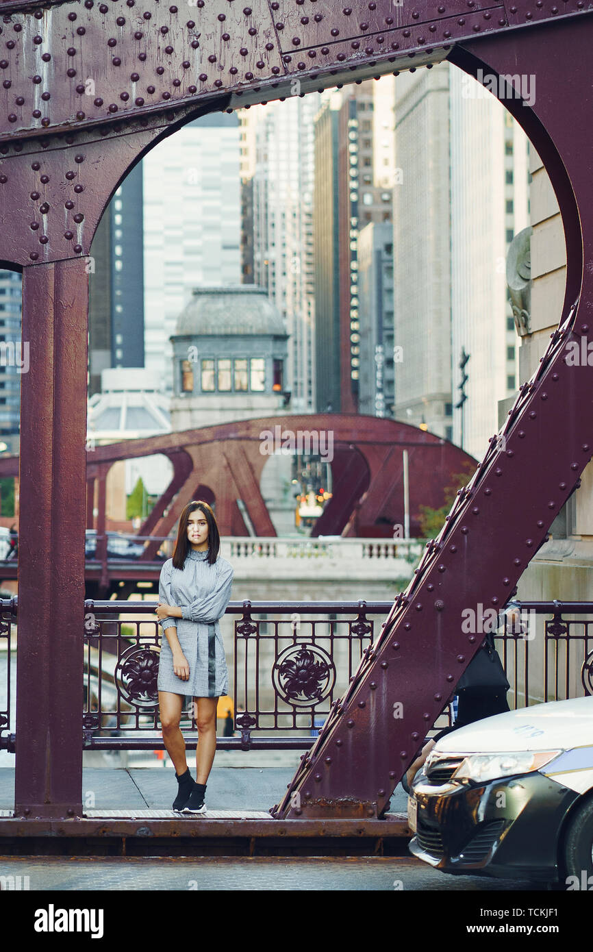 young lady crossing the bridge in the city Stock Photo - Alamy