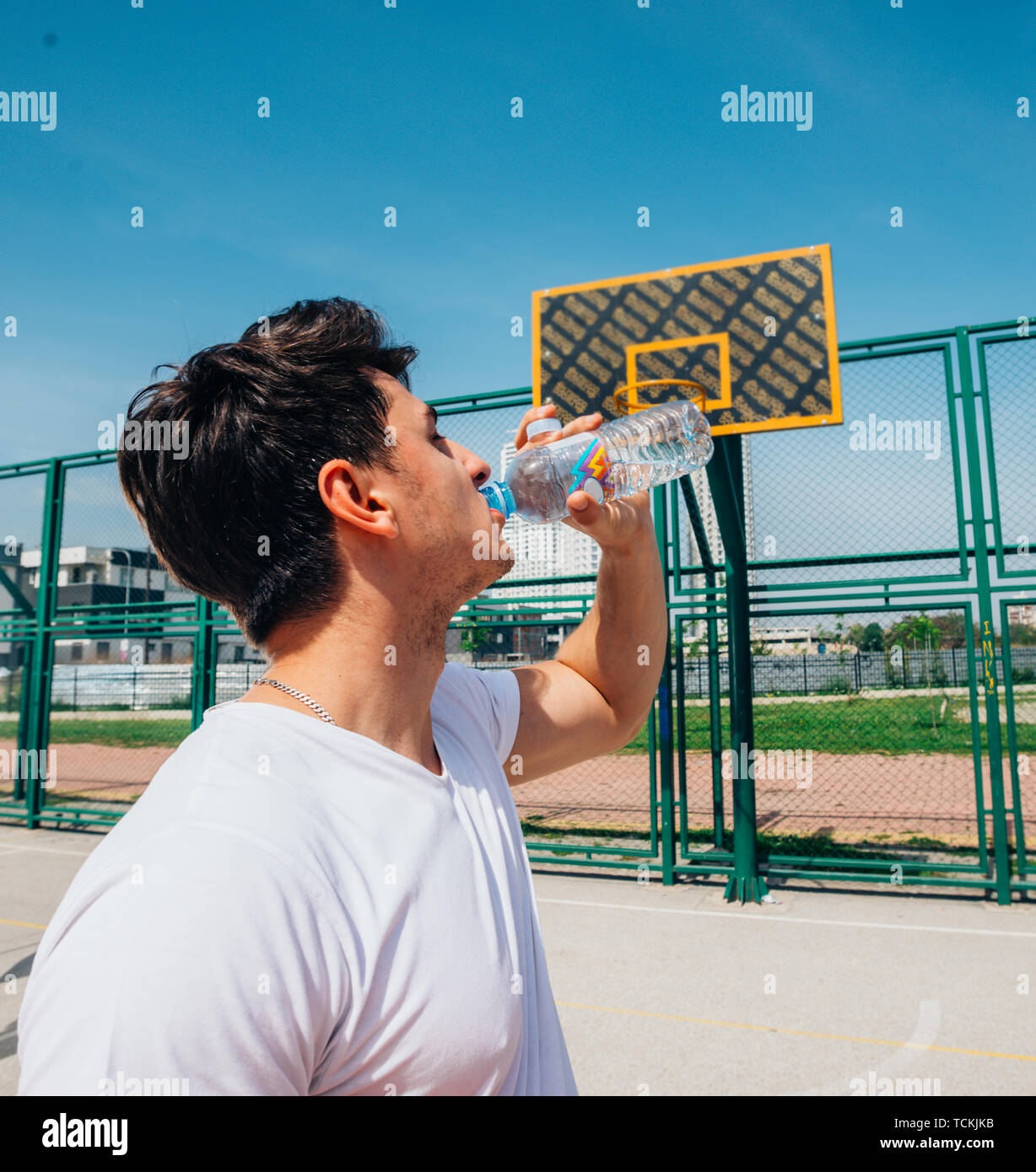 Athletes drinking water and having a break after a long exhausting ...