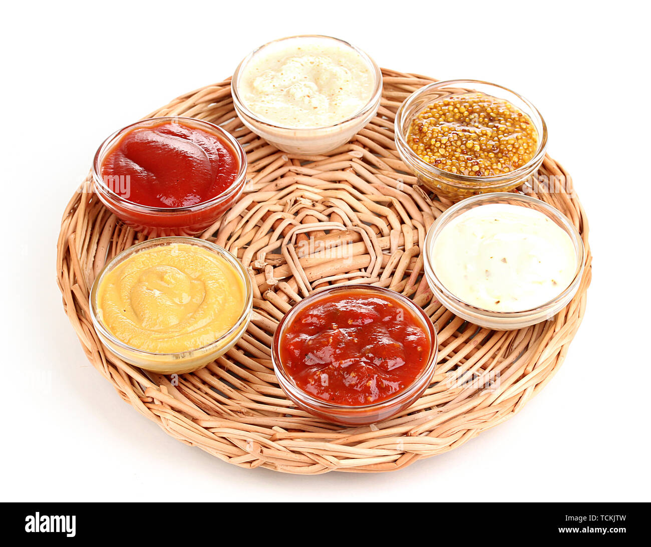 various sauces on wicker mat isolated on white Stock Photo - Alamy