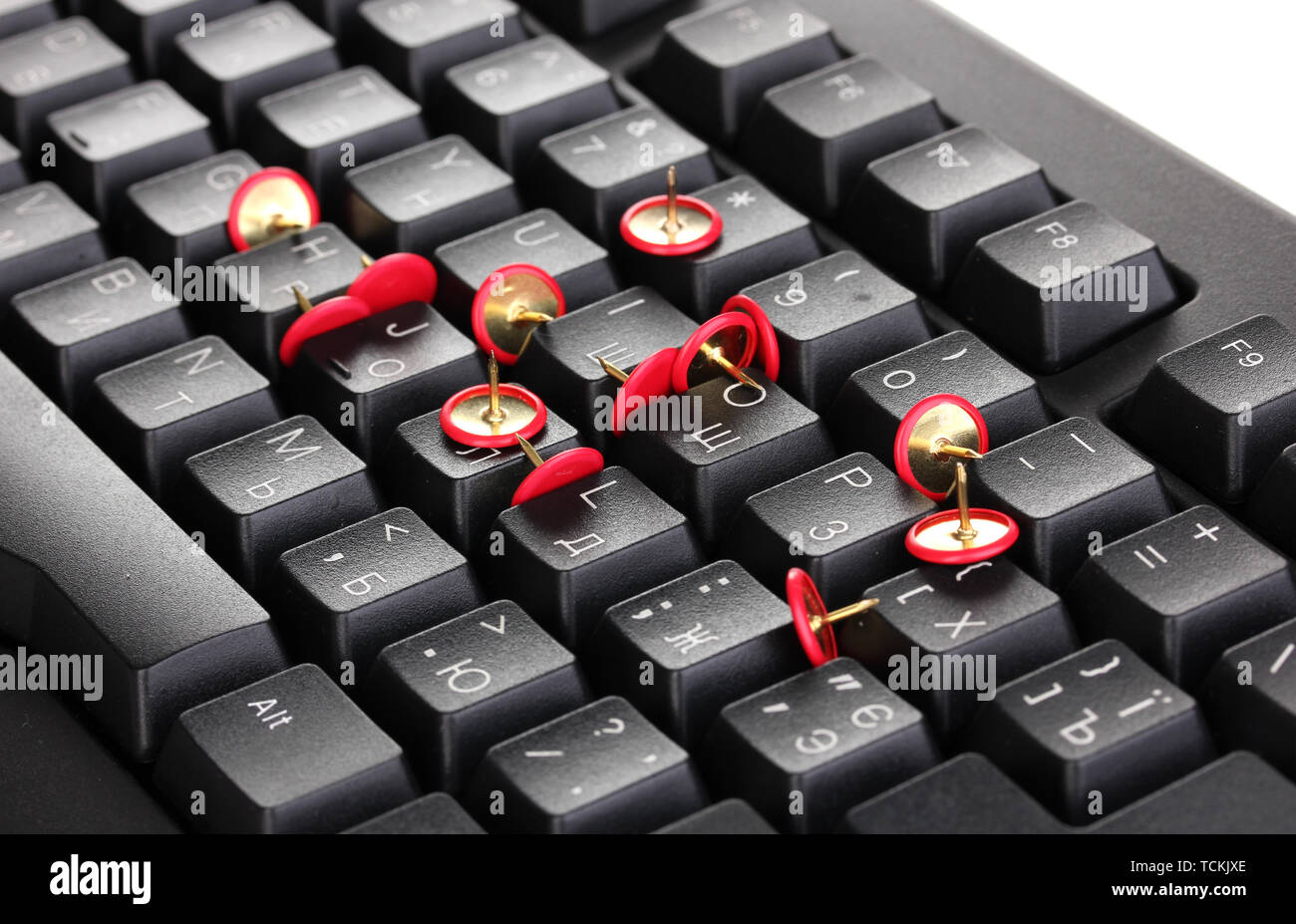 Painful typing, pins on keyboard close-up Stock Photo - Alamy