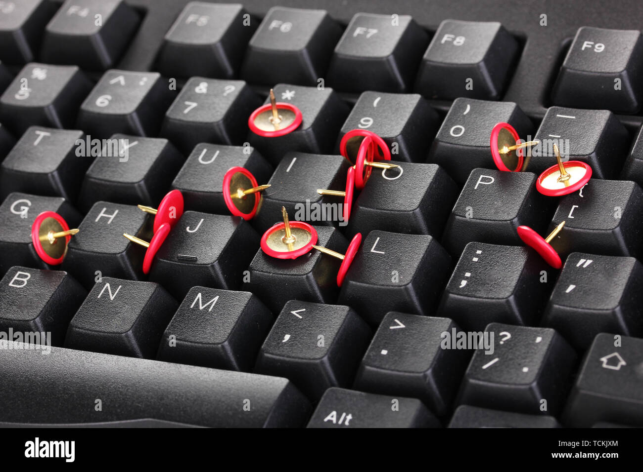 Painful typing, pins on keyboard close-up Stock Photo - Alamy