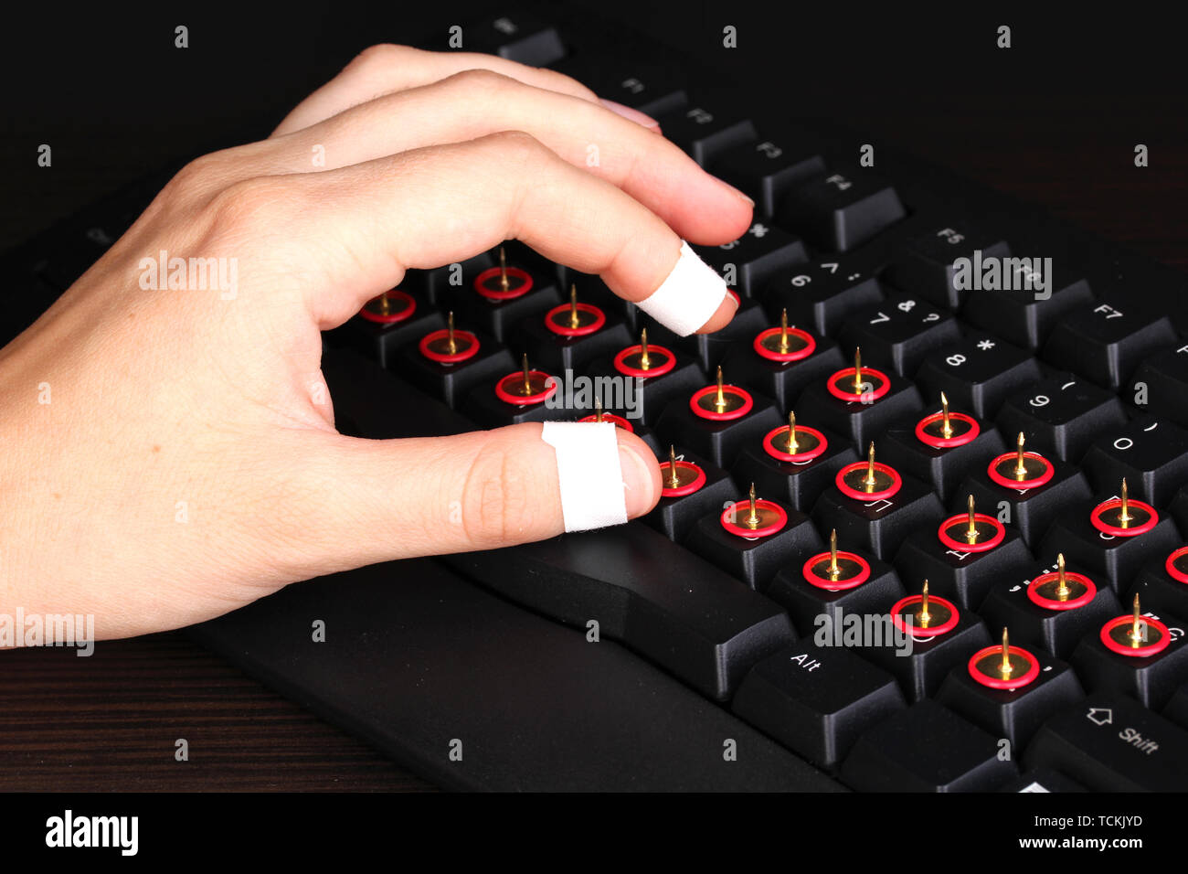 Painful typing on keyboard close-up Stock Photo - Alamy