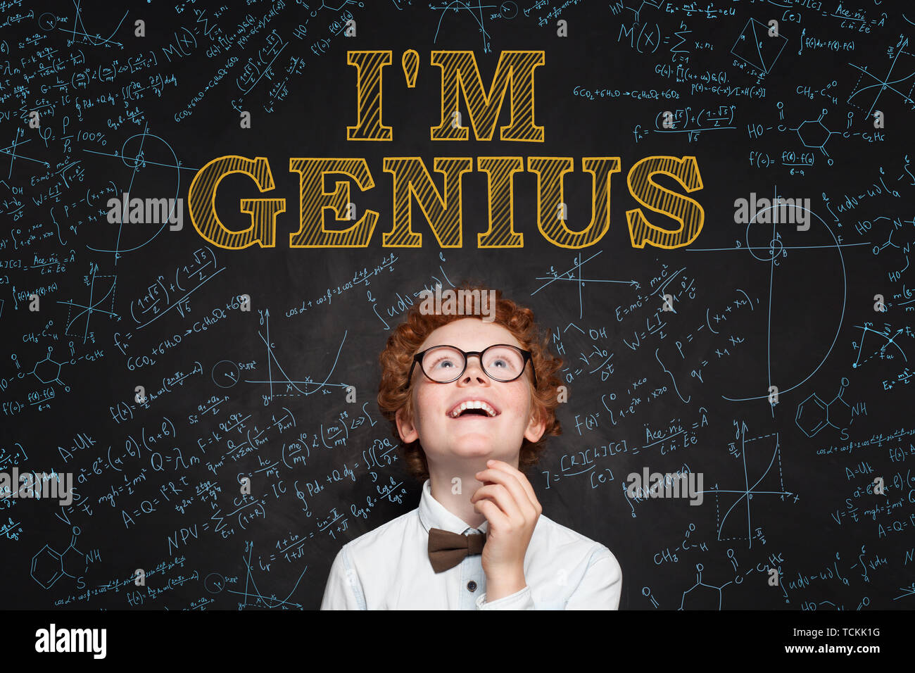 Happy child student on blackboard background with science and maths ...