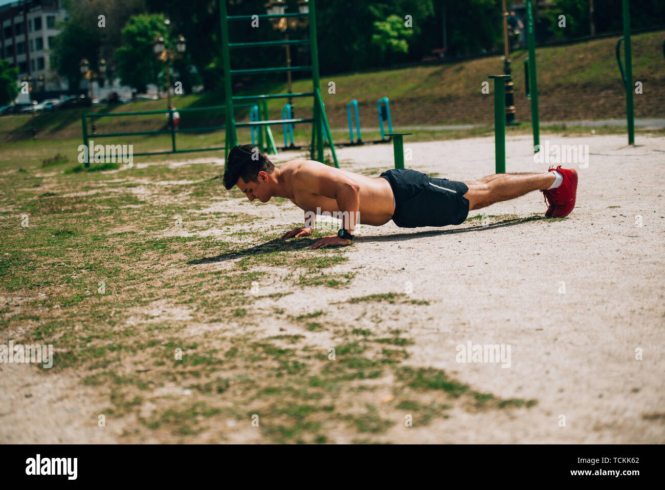 Full length shot of a fit young man performing planking exercise Stock ...