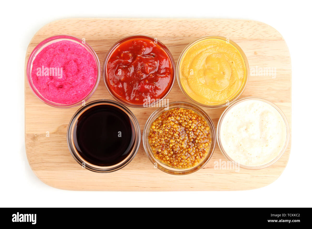 various sauces on chopping board isolated on white Stock Photo - Alamy