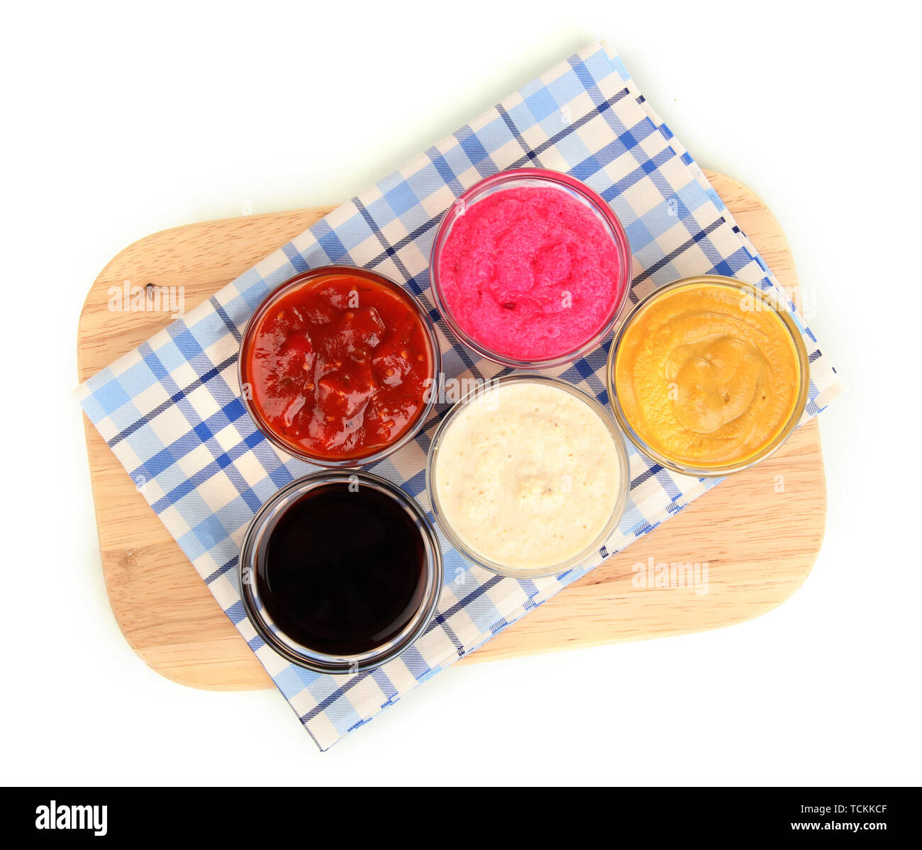 various sauces on chopping board isolated on white Stock Photo - Alamy