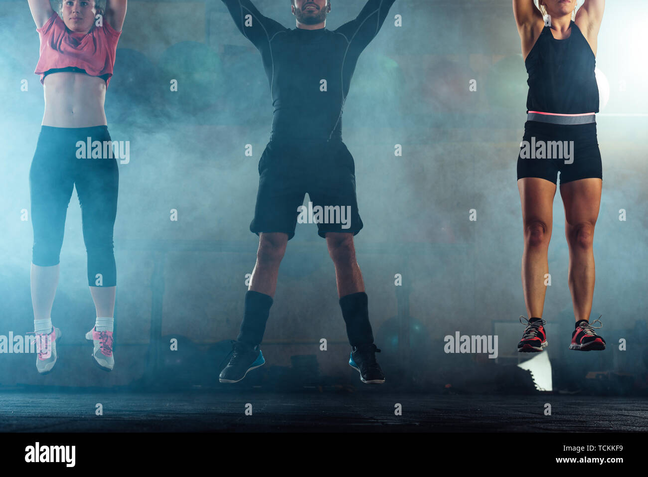 Group of sportive people training in a gym Stock Photo - Alamy