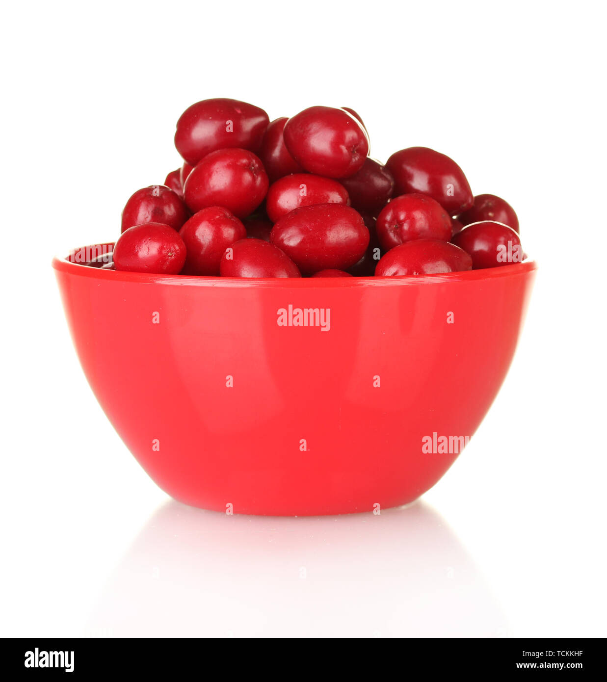 fresh cornel berries in red bowl isolated on white Stock Photo - Alamy