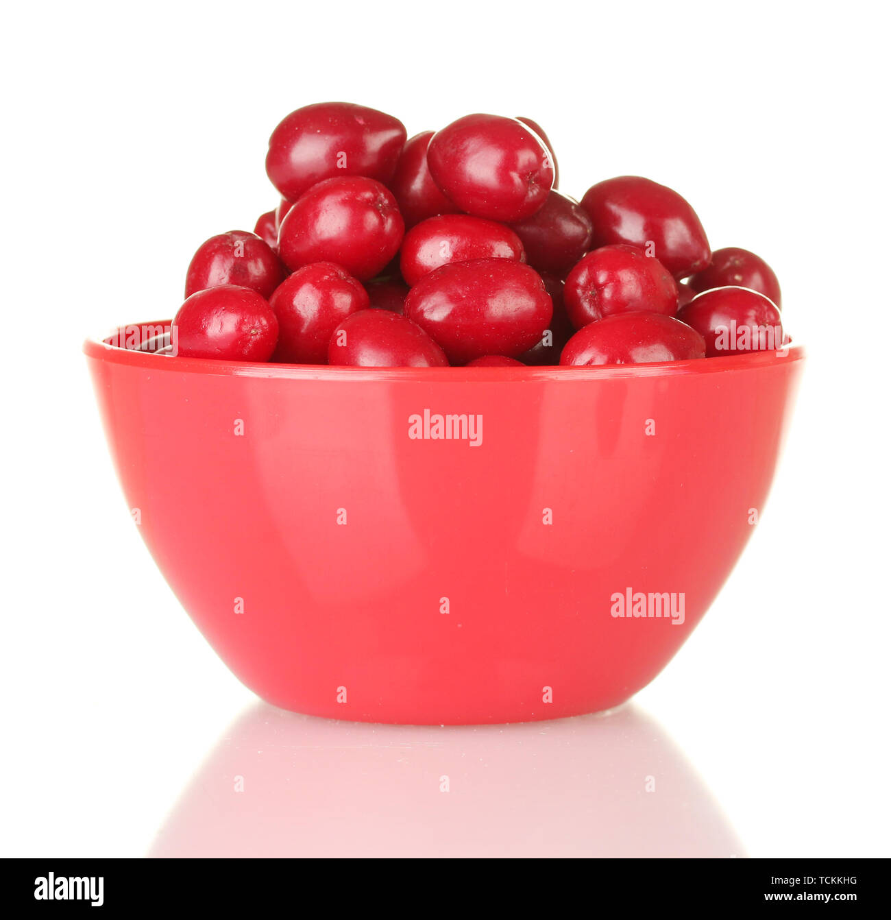 fresh cornel berries in red bowl isolated on white Stock Photo - Alamy