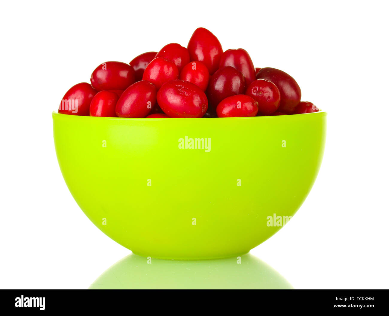 fresh cornel berries in green bowl isolated on white Stock Photo - Alamy