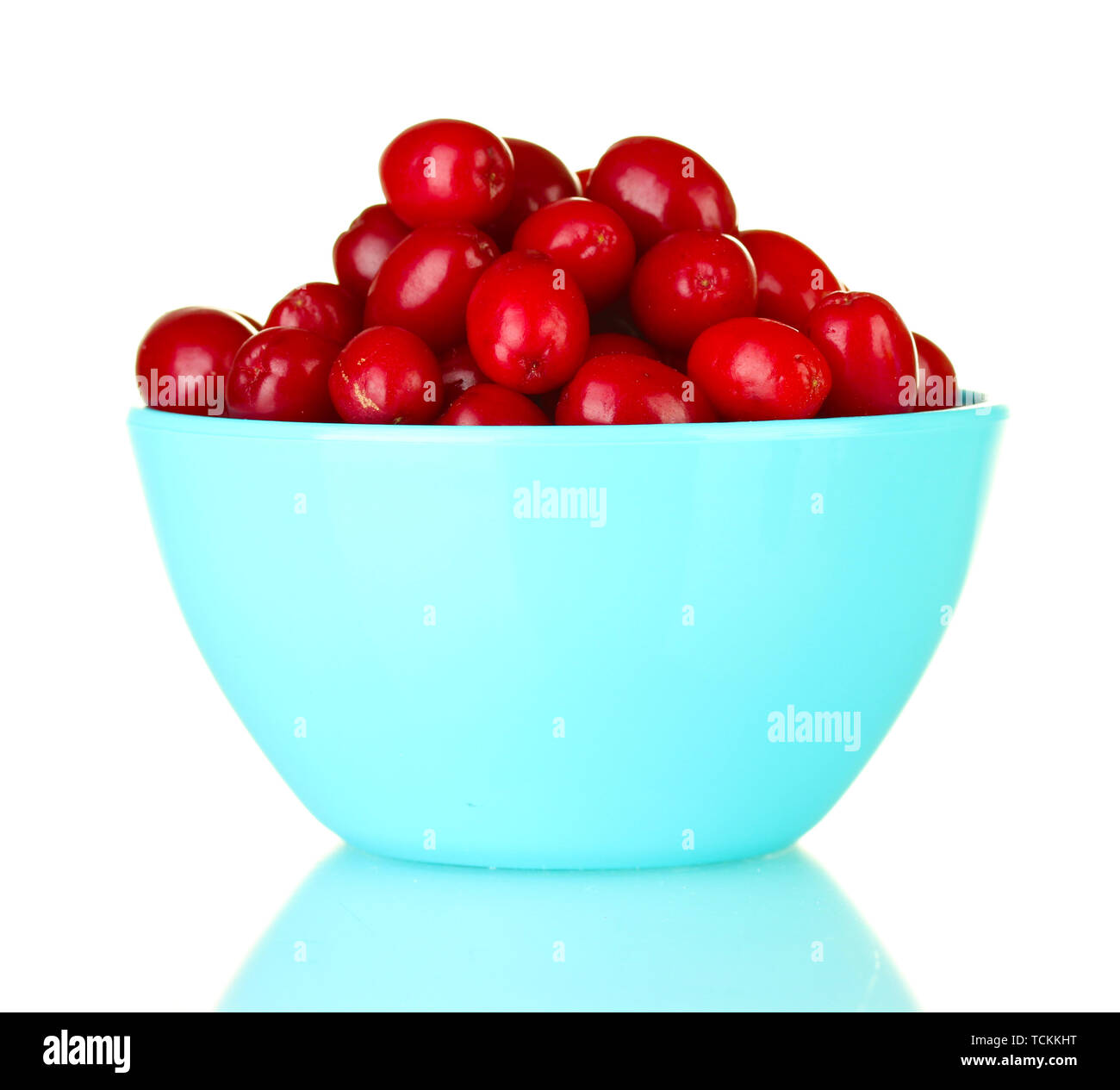 fresh cornel berries in blue bowl isolated on white Stock Photo - Alamy