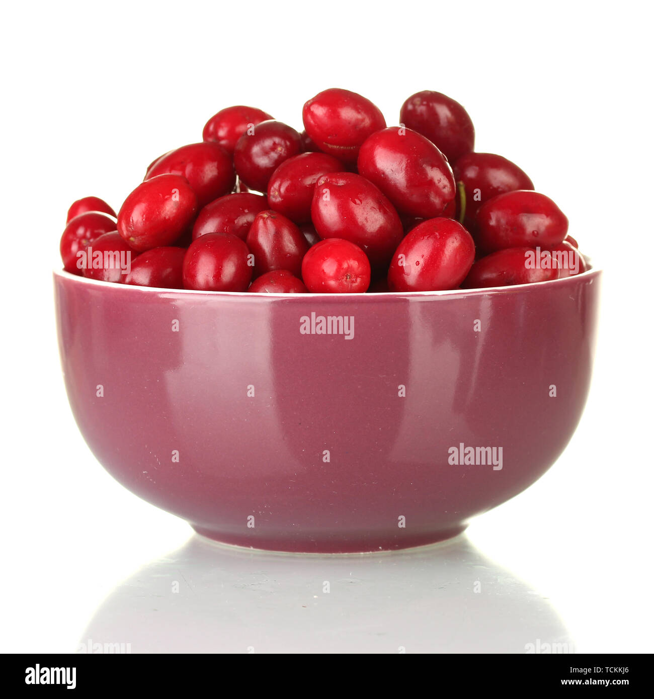 fresh cornel berries in bowl isolated on white Stock Photo - Alamy