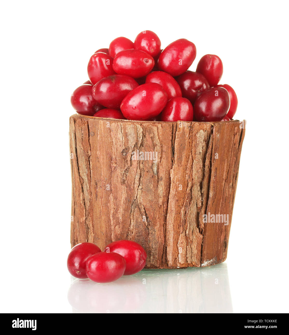 fresh cornel berries in wooden cup isolated on white Stock Photo - Alamy