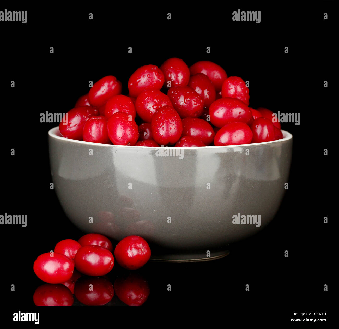 fresh cornel berries in bowl isolated on white Stock Photo - Alamy
