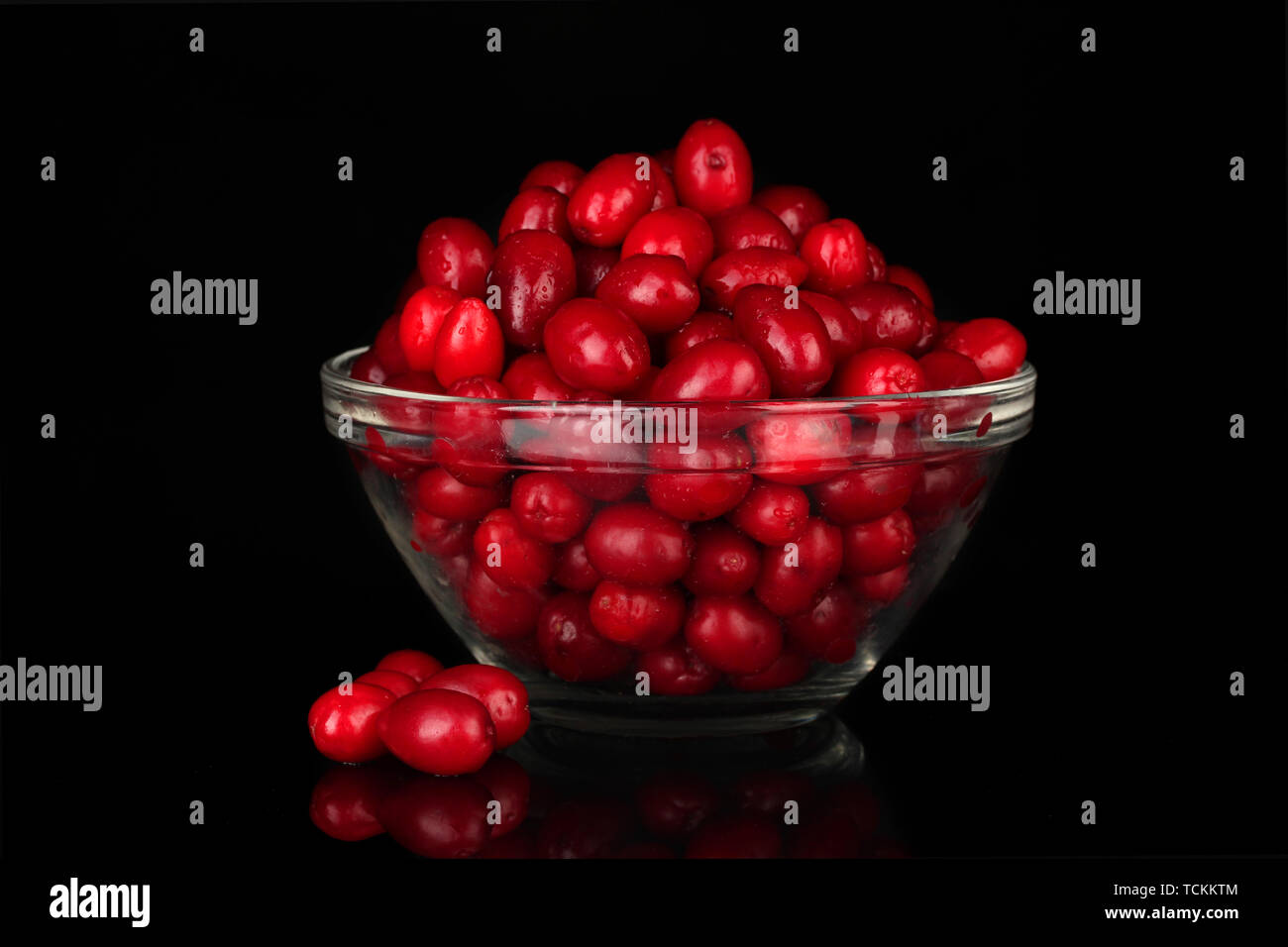 fresh cornel berries in glass bowl isolated on white Stock Photo - Alamy