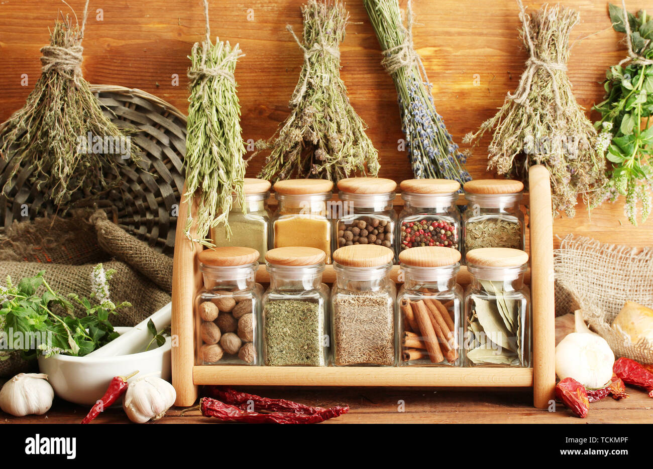 dried herbs, spices and and pepper, on wooden background Stock Photo ...