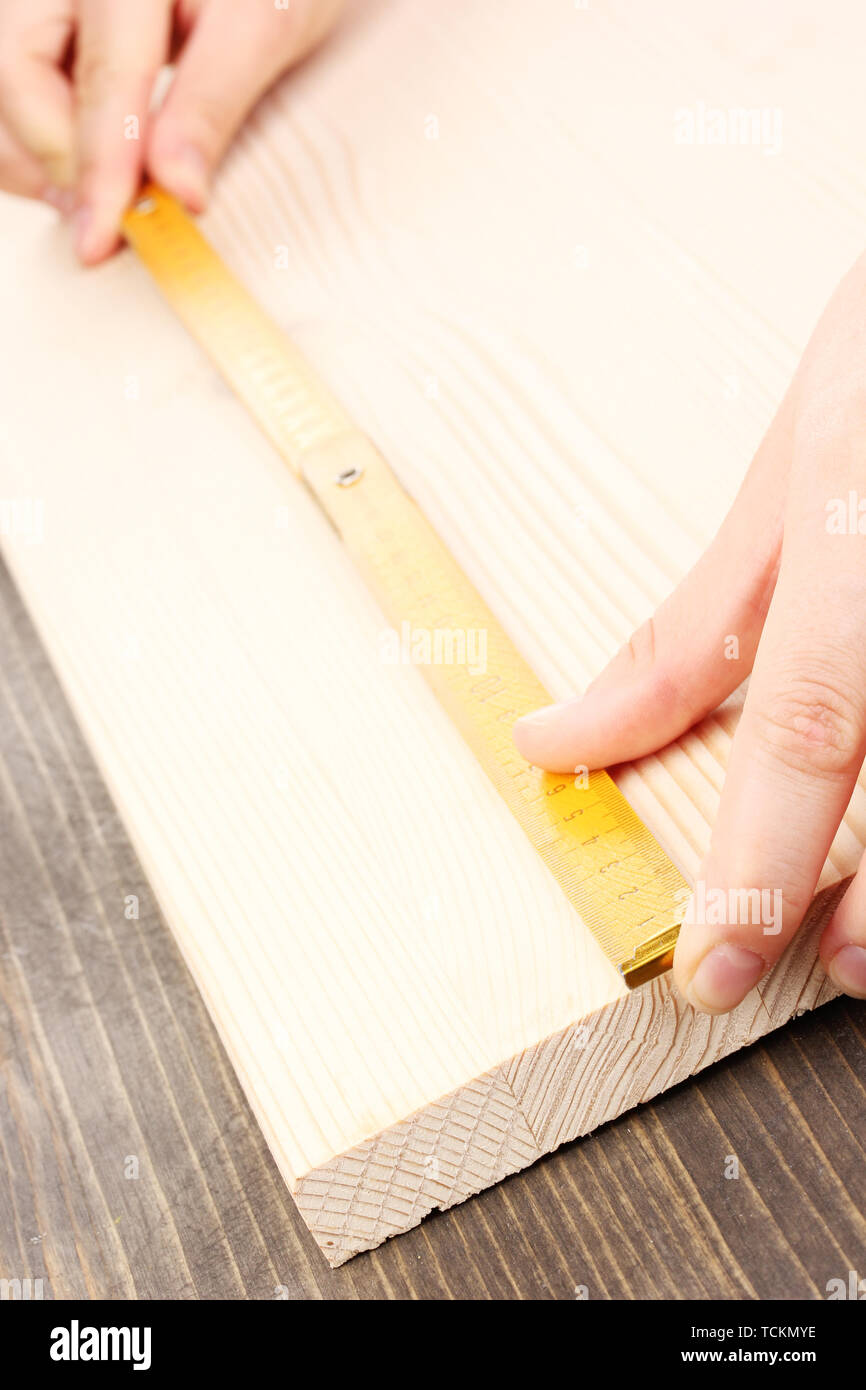 measuring wooden board close-up Stock Photo - Alamy