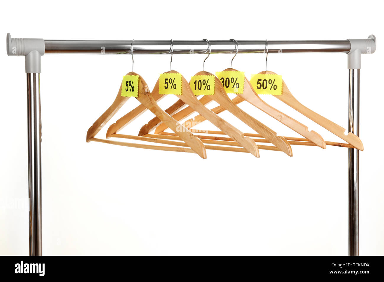 wooden clothes hangers as sale symbol isolated on white Stock Photo - Alamy