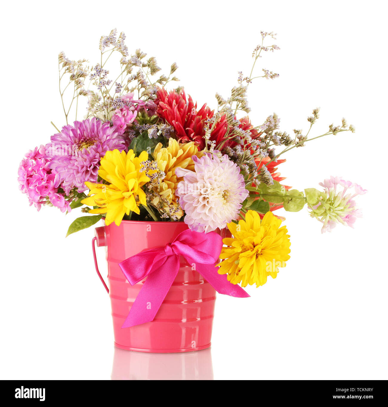 Bright pink bucket with flowers isolated on white Stock Photo - Alamy