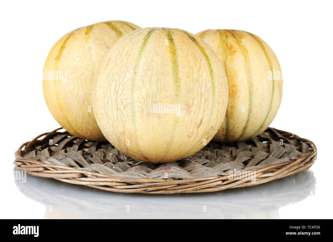sweet melons on wicker mat isolated on white background Stock Photo - Alamy