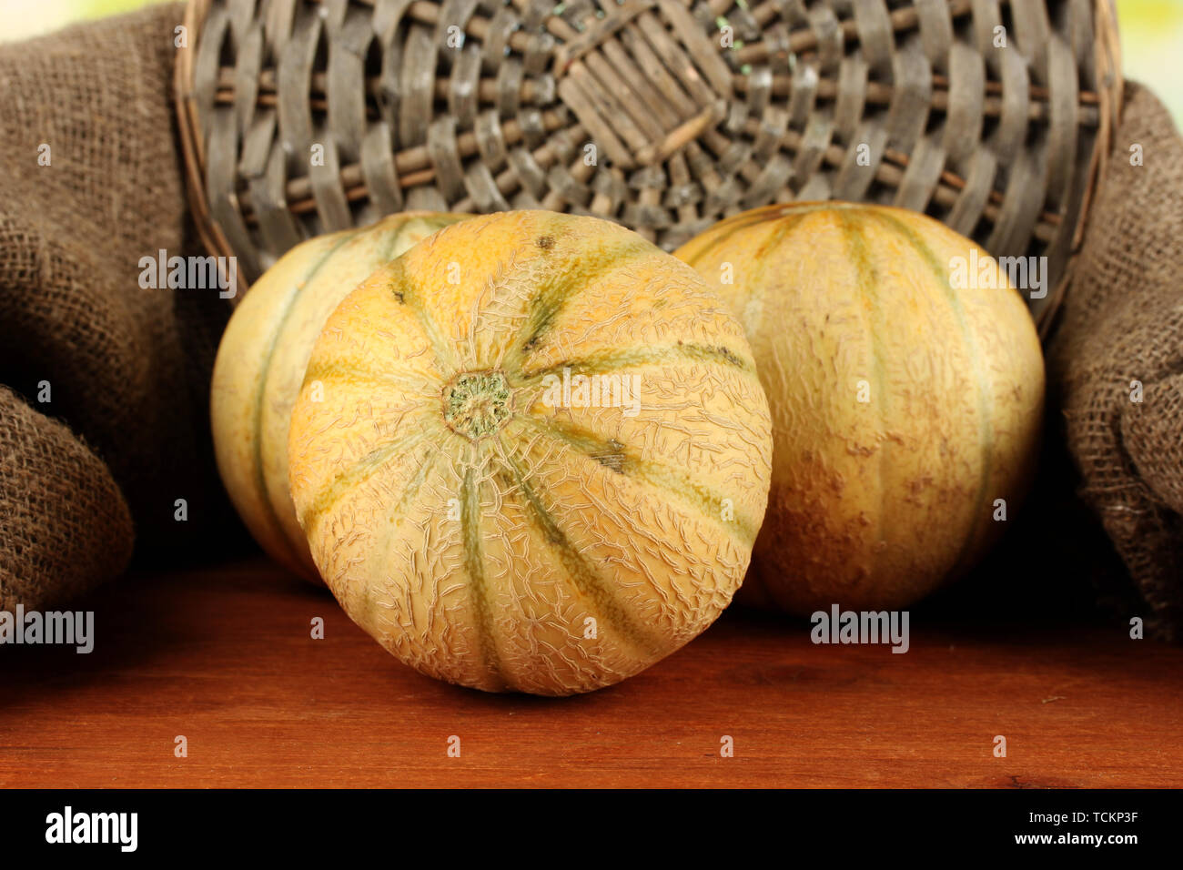 sweet melon on wicker mat on sackcloth background close-up Stock Photo ...