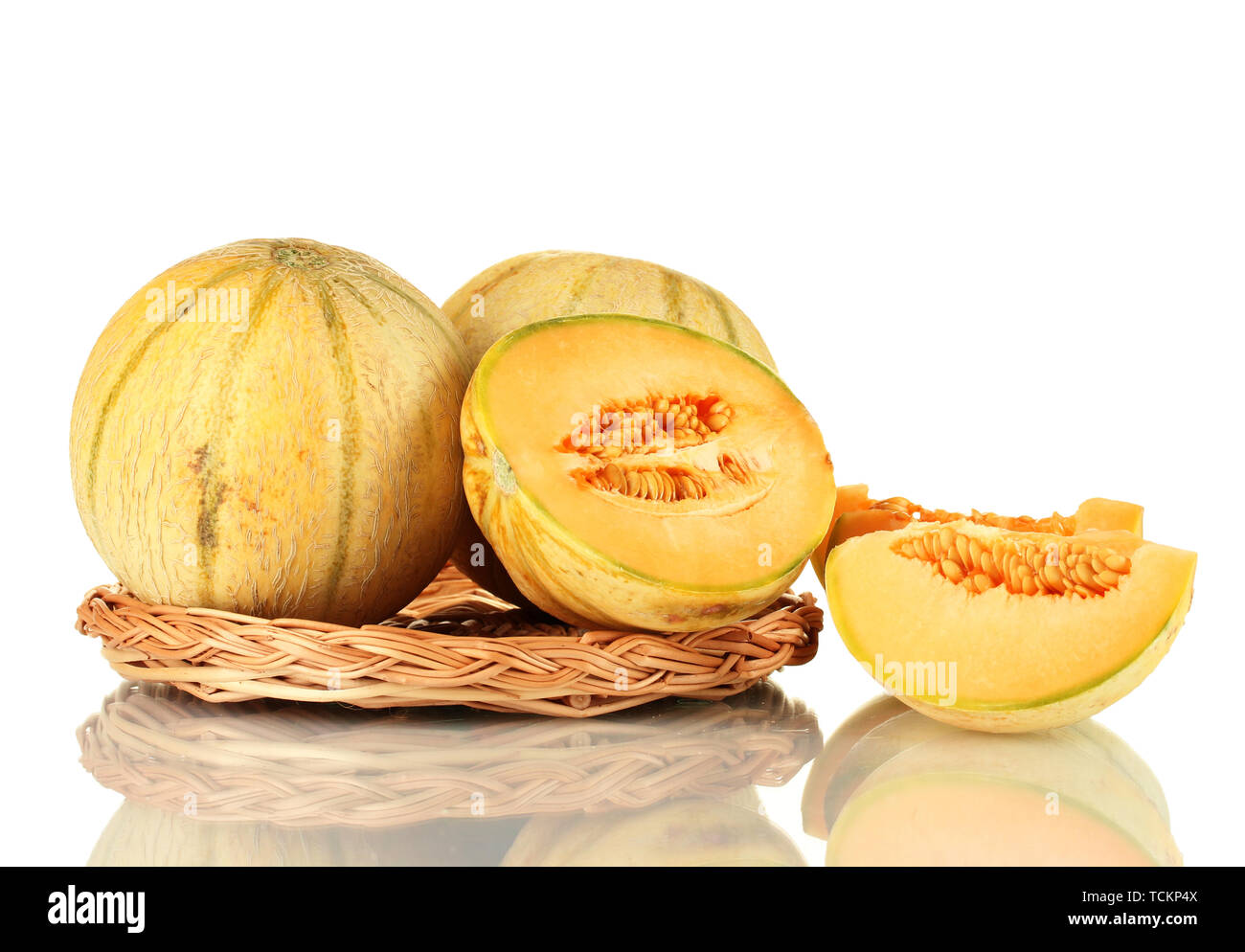 cut melon on wicker mat isolated on white Stock Photo - Alamy